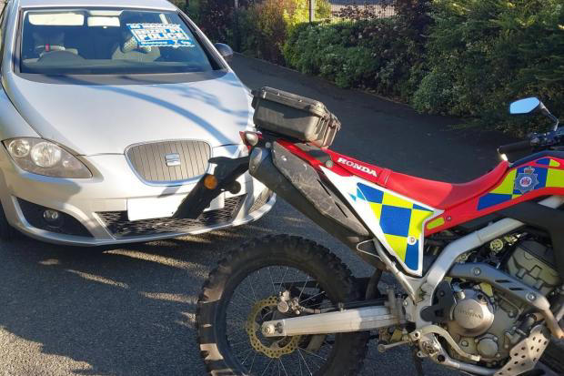 Police noticed 'too many legs and feet on show in the rear of the car'