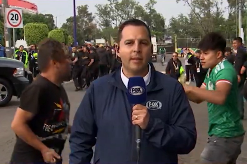 World Cup show interrupted by two Mexico fans throwing punches on live TV