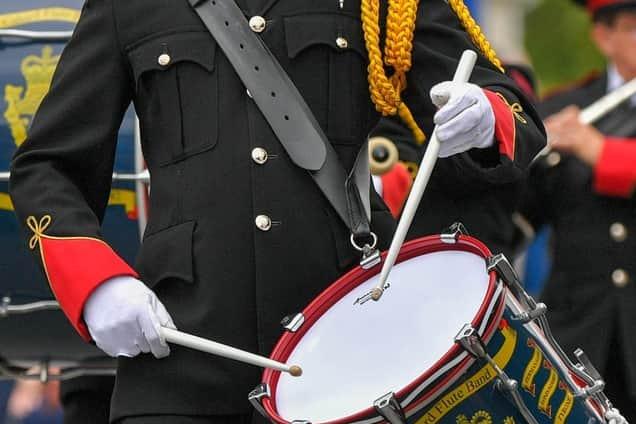 Lambeg Orange and Blue Flute Band tune up for anniversary parade