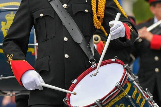 Lambeg Orange and Blue Flute Band tune up for anniversary parade