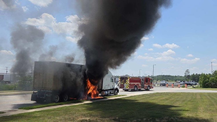 Tractor-trailer hauling solar panels catches fire in Suffolk