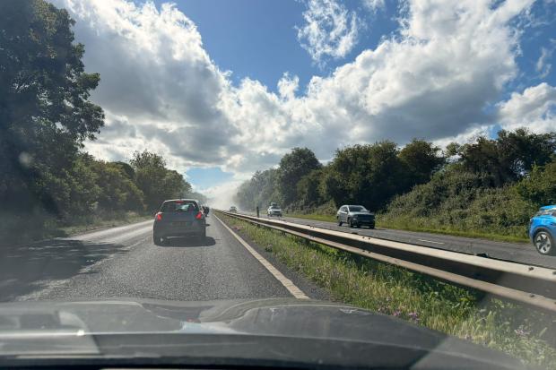 Car 'stranded' in lane as smoke billows across busy dual carriageway
