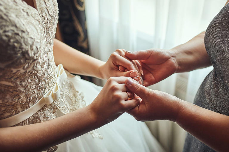 Bride visits mother in hospital in her wedding attire before ceremony