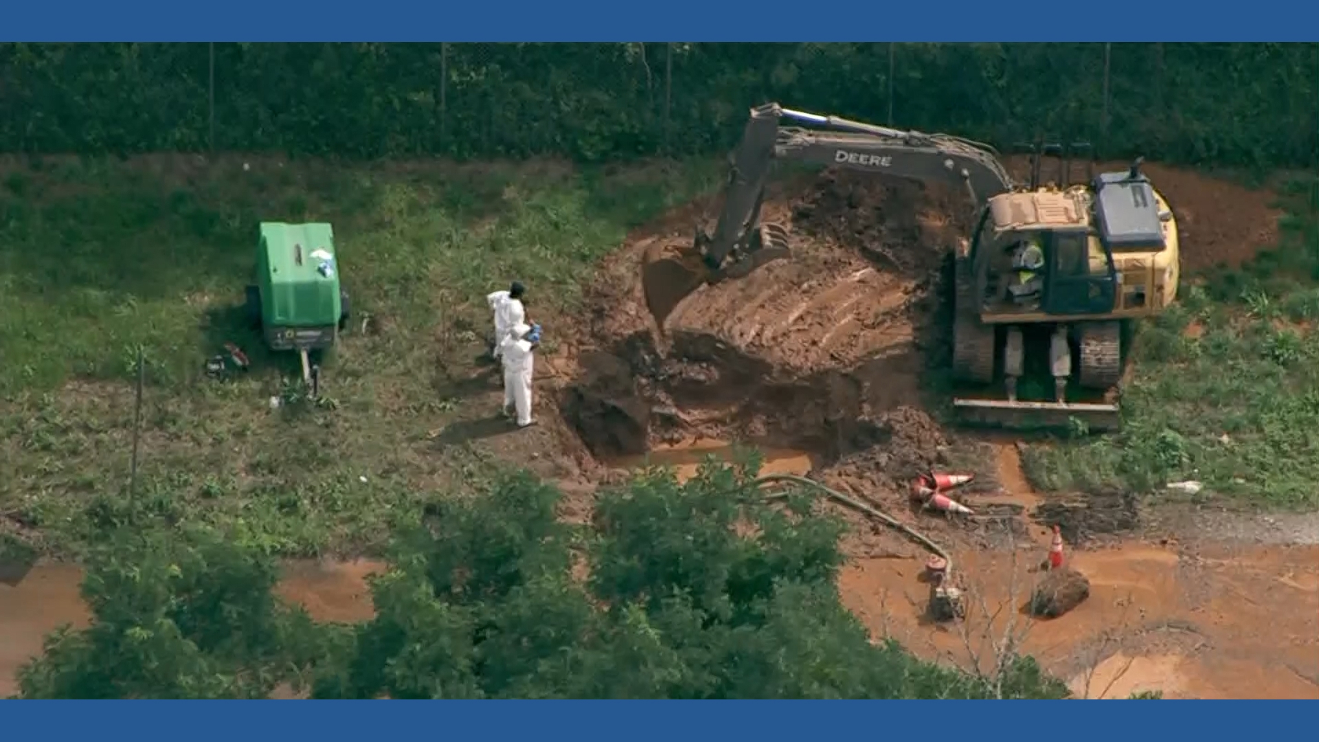 Aerial view shows crews in DeKalb County repairing water main break