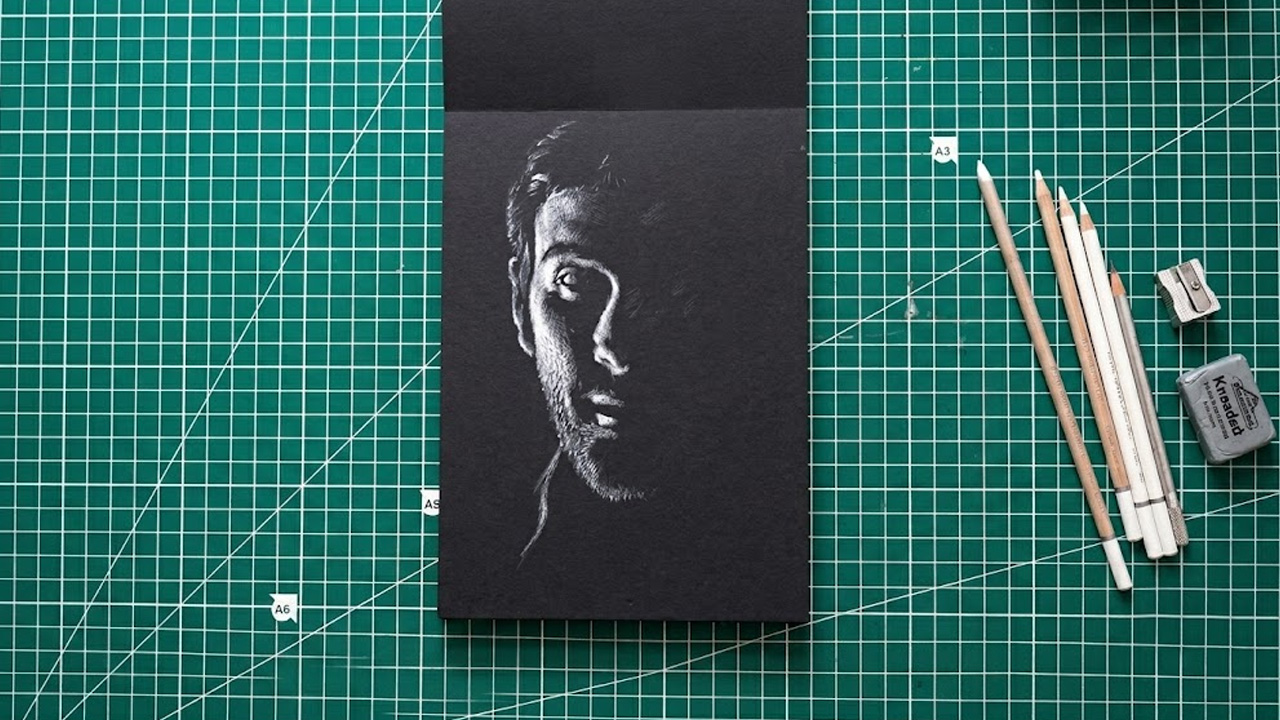 Dramatic white pencil drawing on black paper with light and shadows