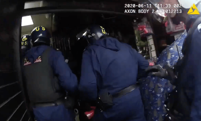 Moment police raid London store as they seize £2.5m in cash and gold