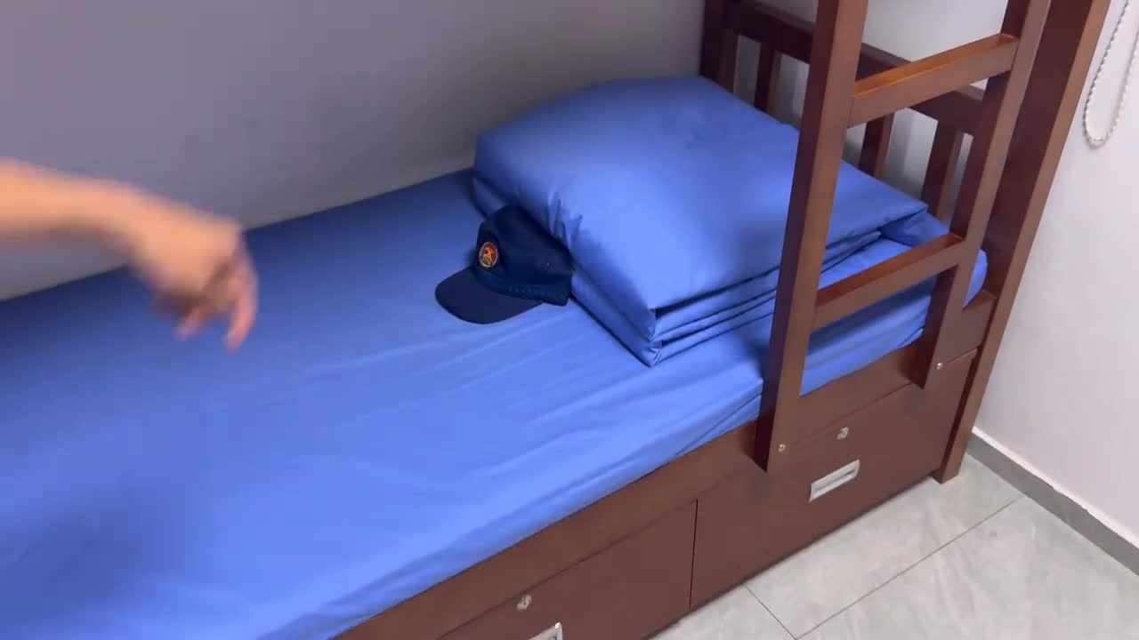 Cat hides under pillows in firefighters’ bunkroom in Shanghai, China