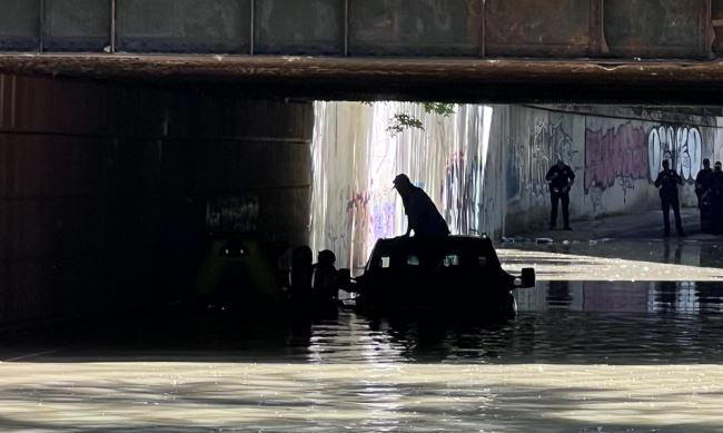 Motorist rescued after being trapped in high water under Cleveland bridge