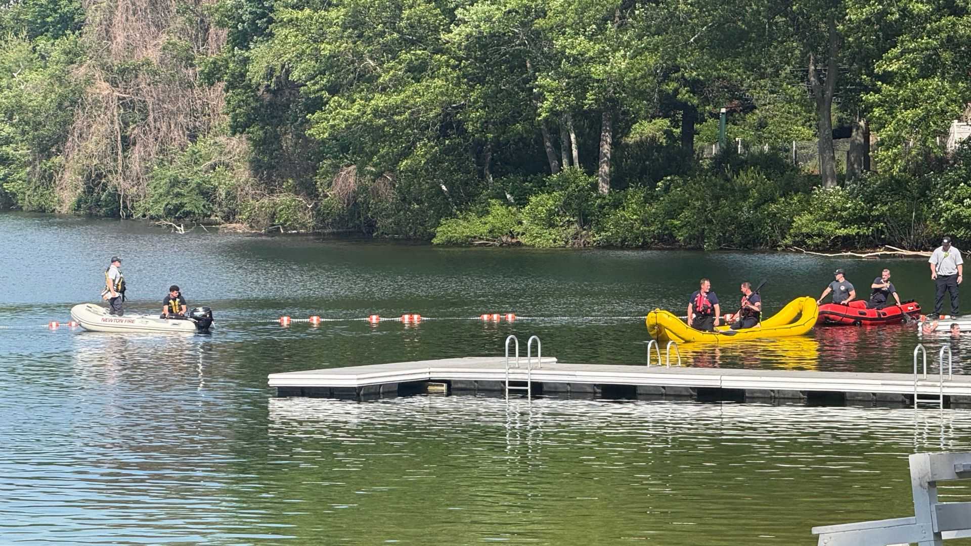 Dive teams search Mass. lake after reported drowning