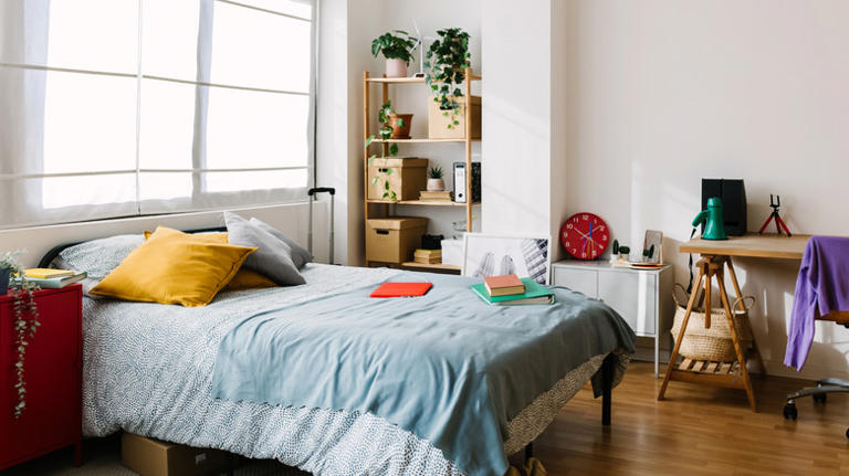 Balance the look of your bed up against the wall with a simple window ...