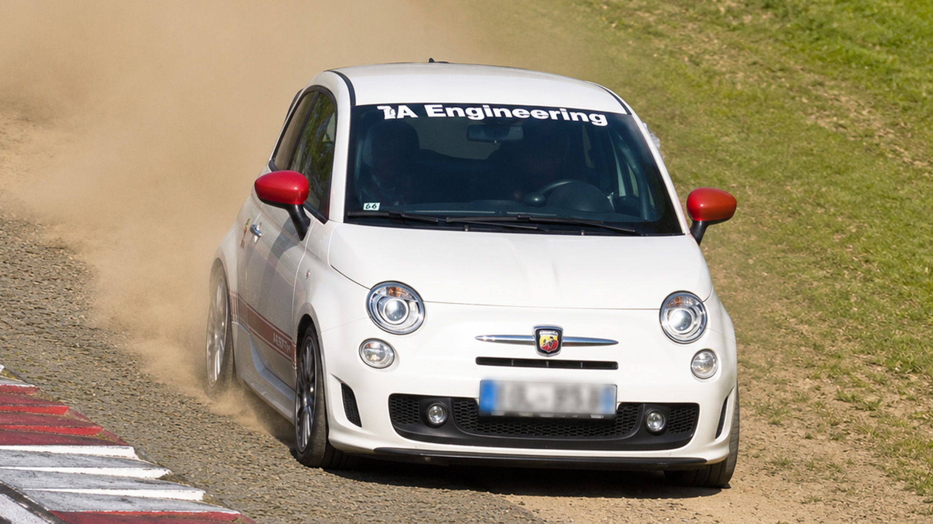 Dust clouds and close calls highlight a busy track day