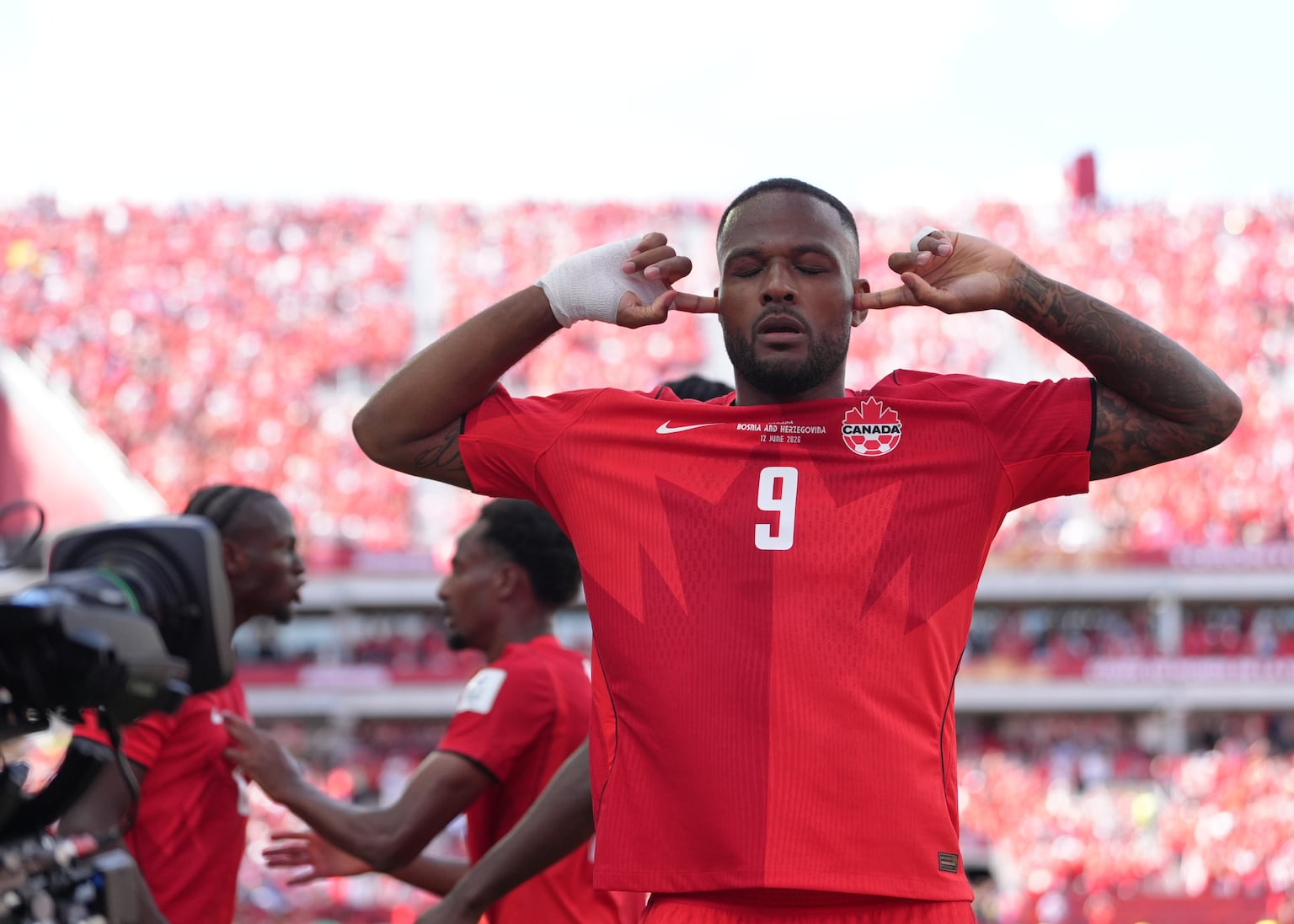 Cyle Larin makes World Cup history for Canada as co-hosts start with a draw