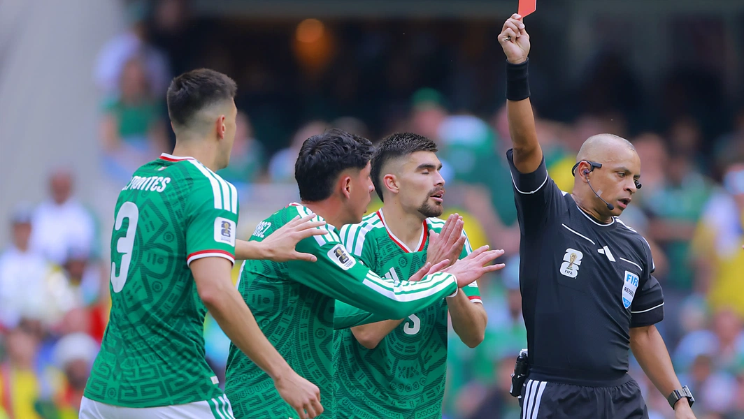 Shearer questions strict refereeing after triple red card opener