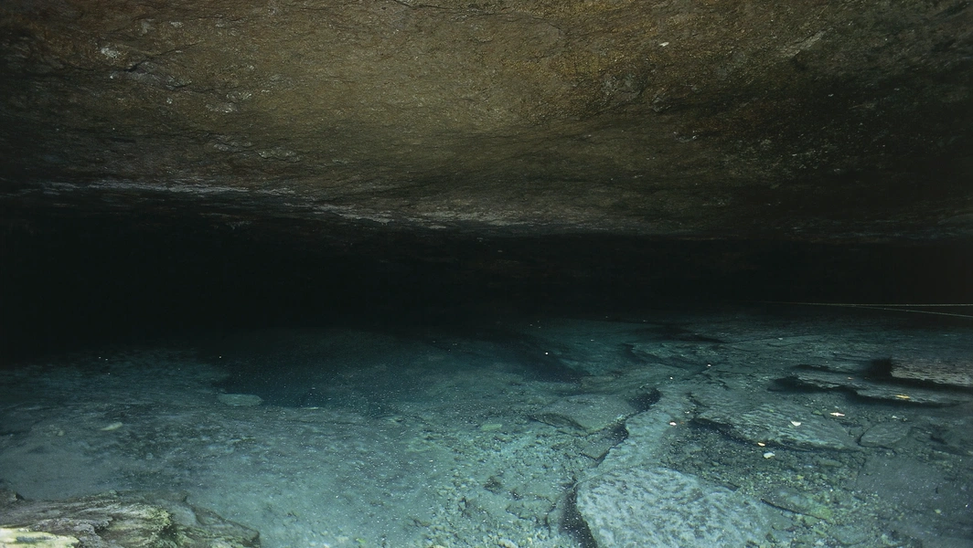 Ancient Maya canoe and sacred cenote discoveries