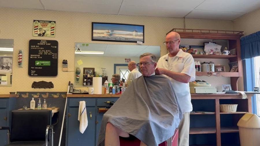 After 35 years, Dimondale barber says goodbye to generations of customers