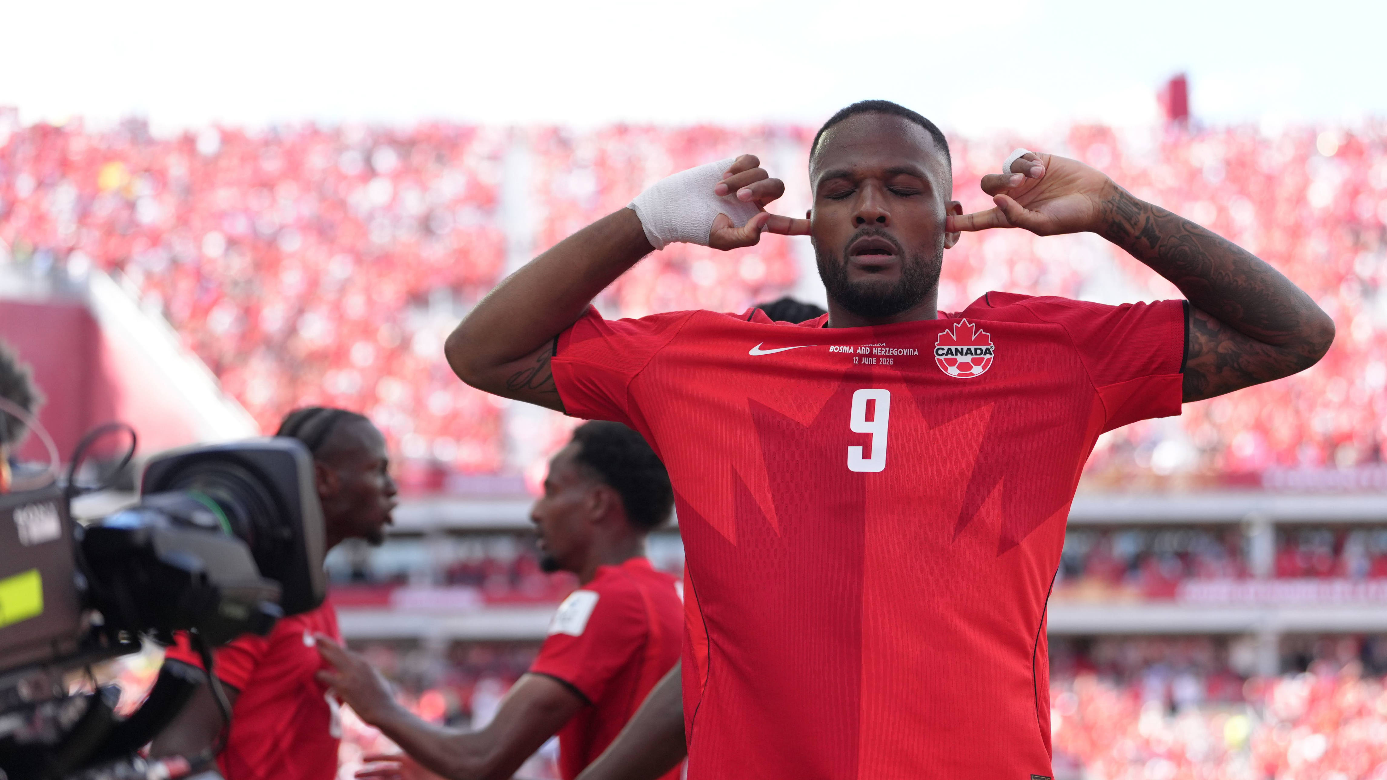 Cyle Larin makes World Cup history for Canada as co-hosts start with a draw