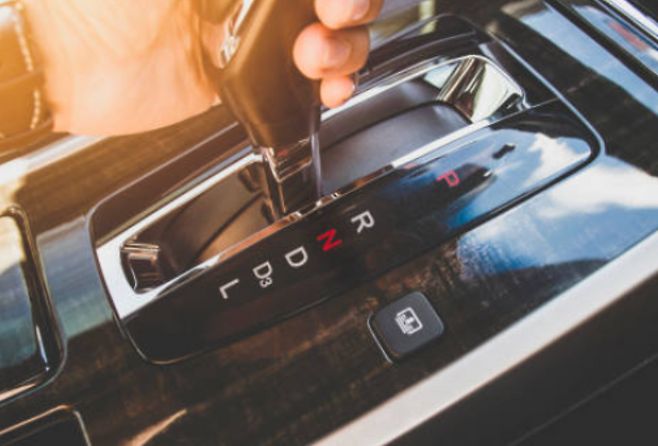 You shift to neutral at every red light—your transmission pays for it