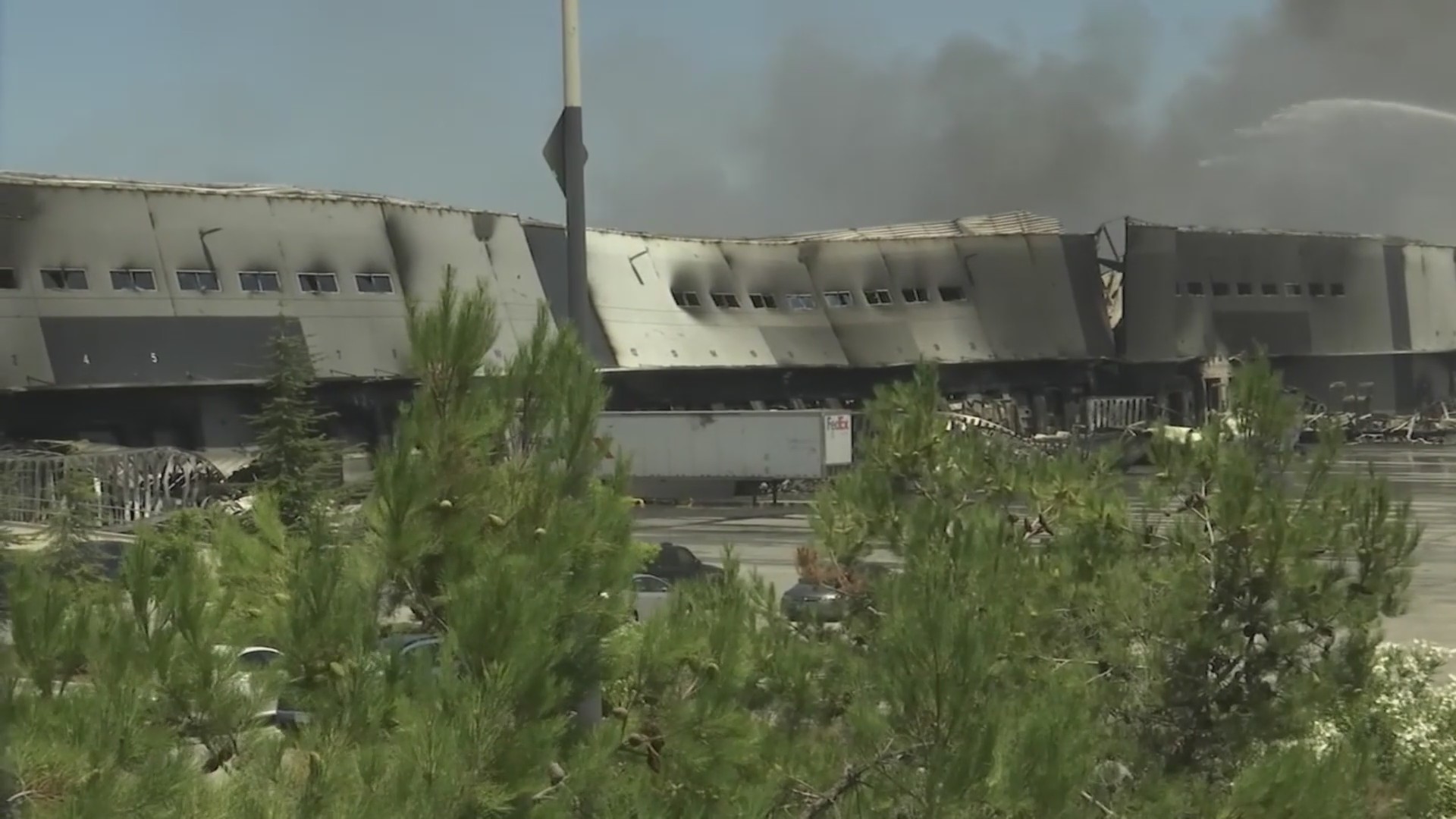 Warehouse fire in Tracy still burning 24 hours later