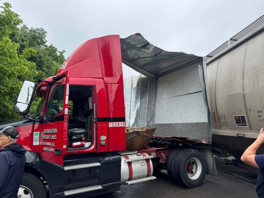 Semi stuck on railroad tracks hit by train in Chapel Hill