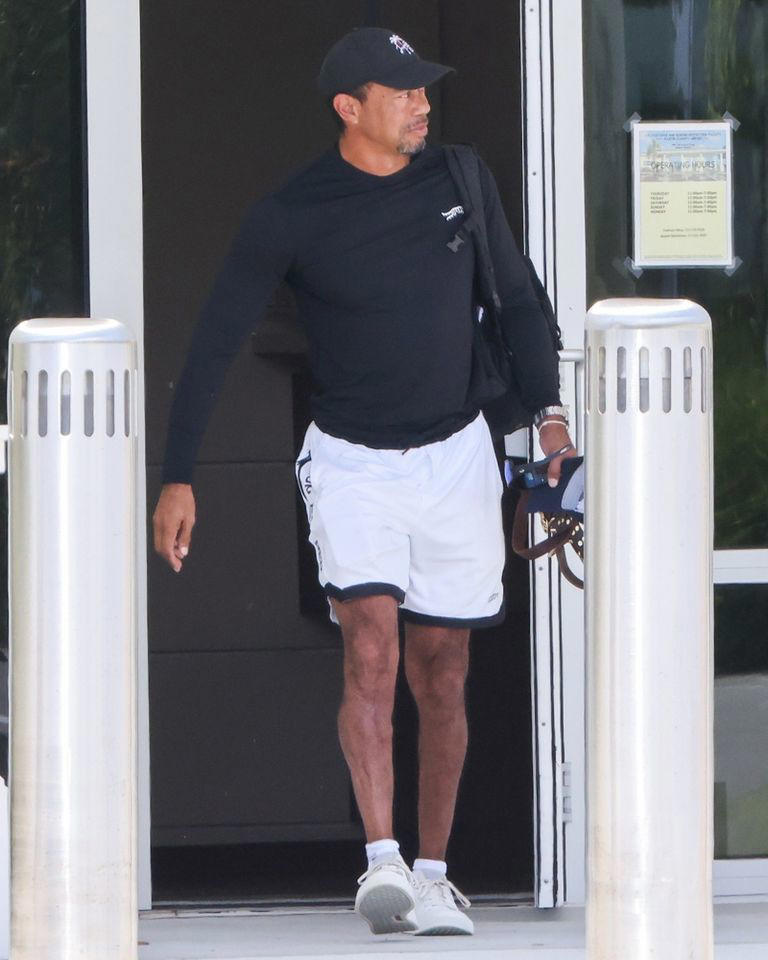 Tiger Woods grins as he's spotted returning home from rehab stint overseas