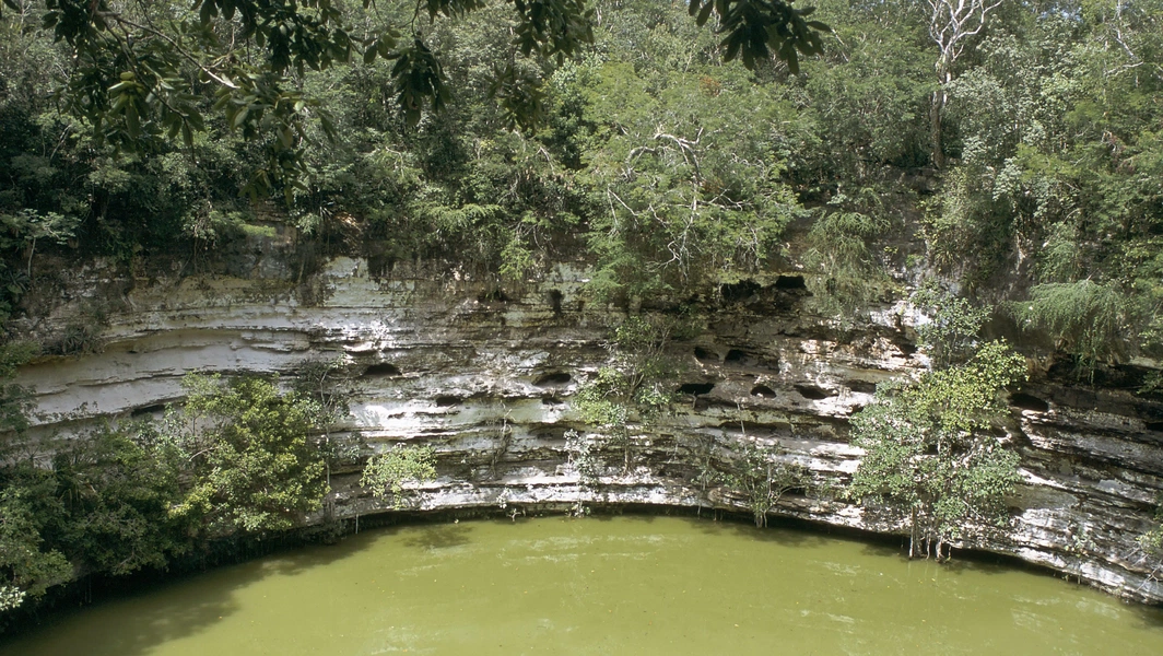 Ancient Maya canoe and sacred cenote discoveries