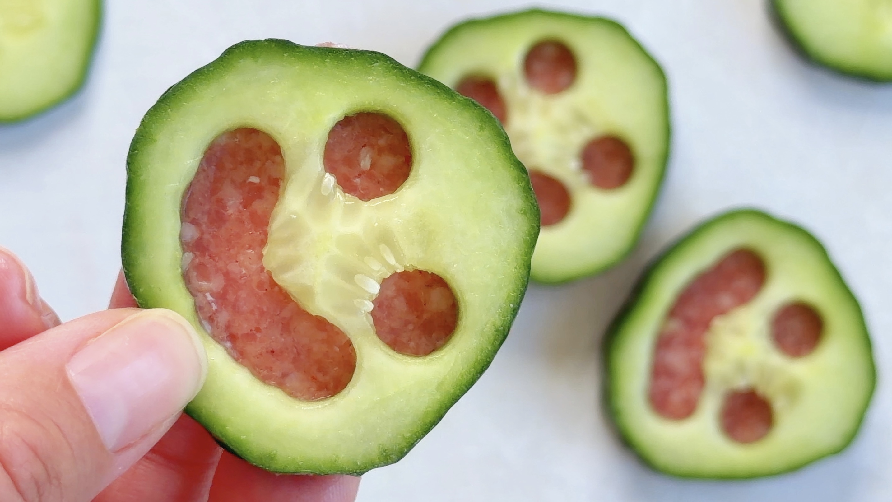 Smiley cucumber bites with salami