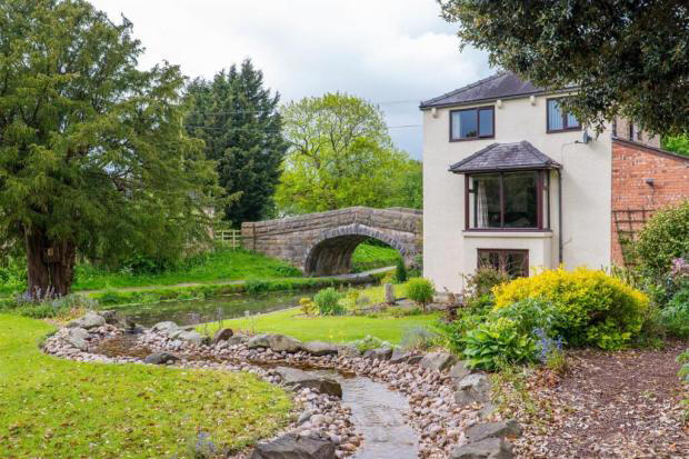 Quirky home built into the end of a bridge is one of most viewed under ...