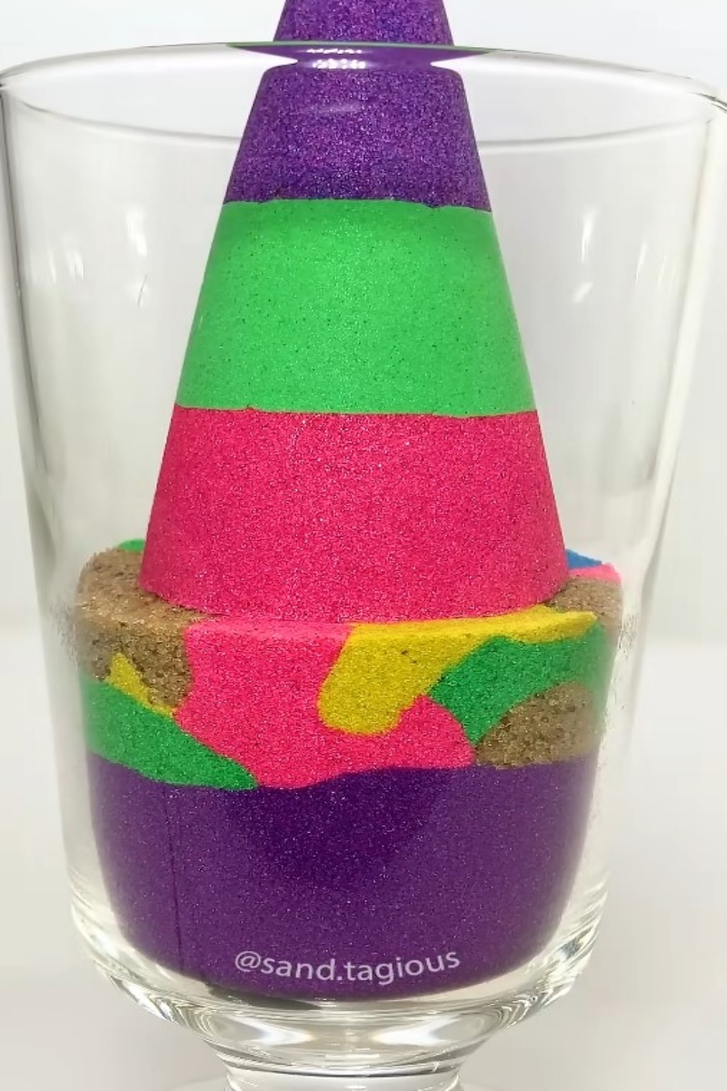 Layered rainbow sand in glass