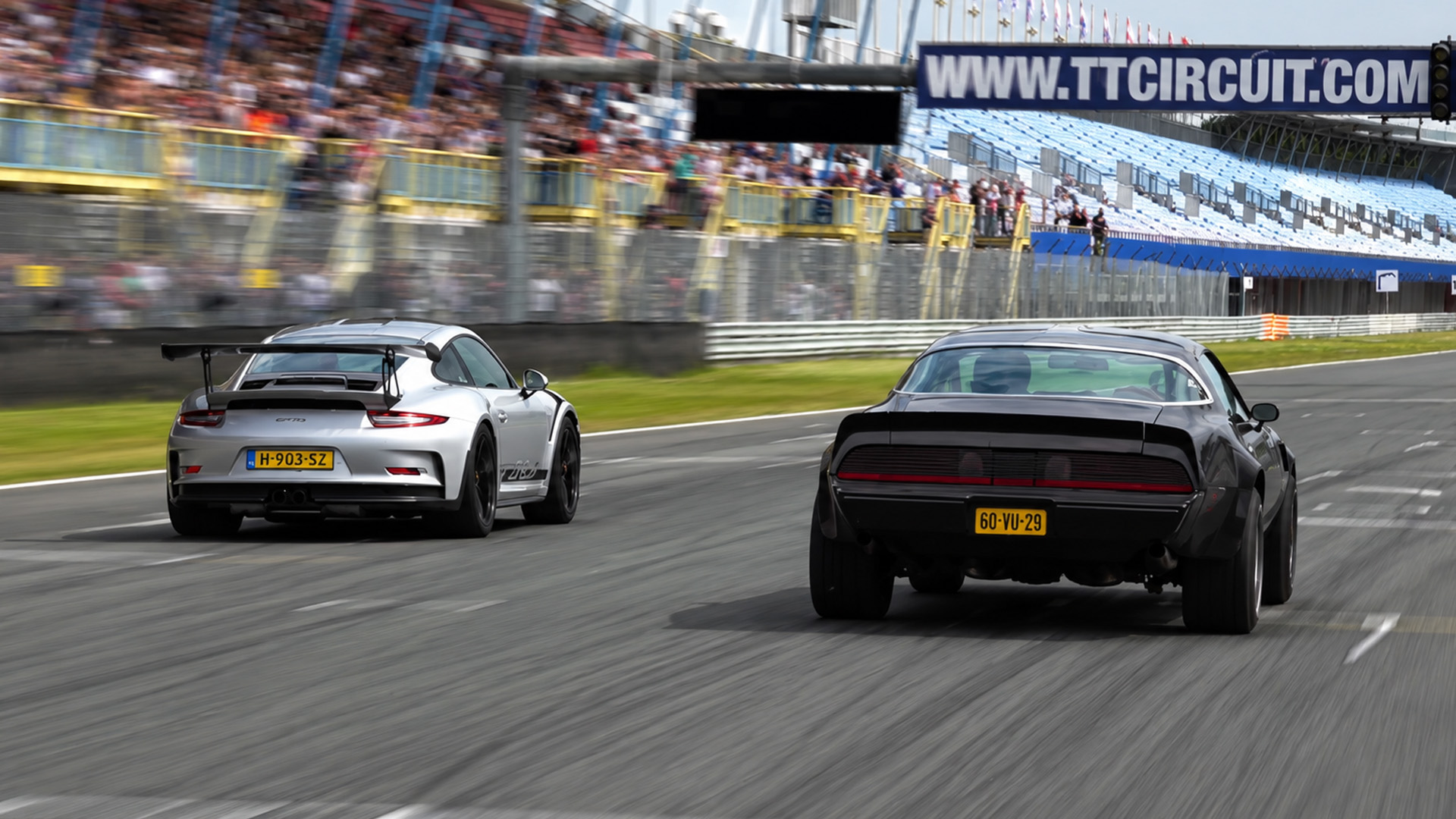 Modern Porsche meets old school muscle power in drag battle