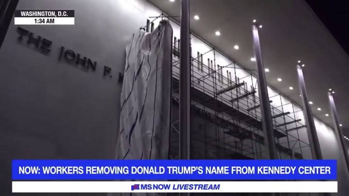 Workers cover front of Kennedy Center with tarp while removing Trump's name