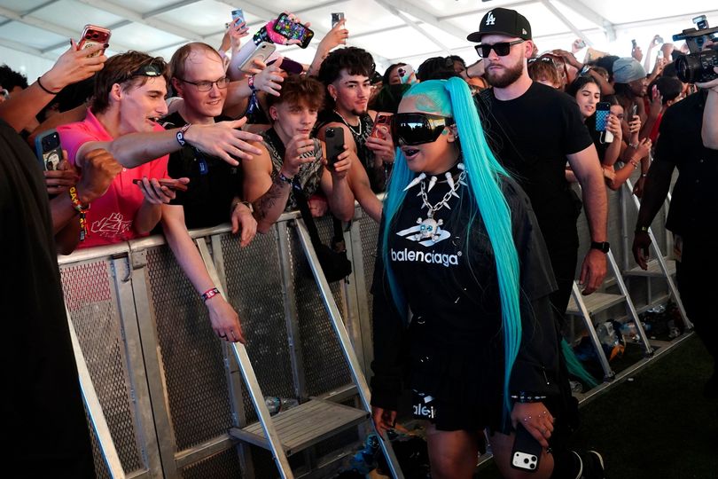 North West, 12, seen in huge choker and blue wig as she performs at ...