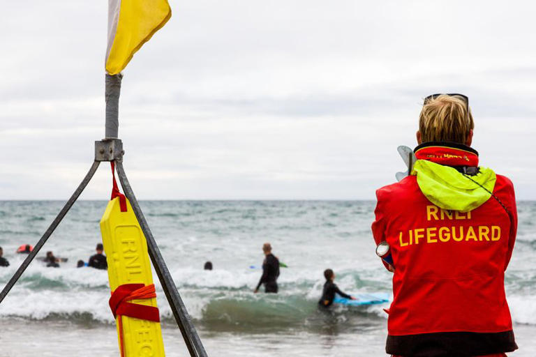 Lifeguard on moment he 'ran into the water' to save two children at ...