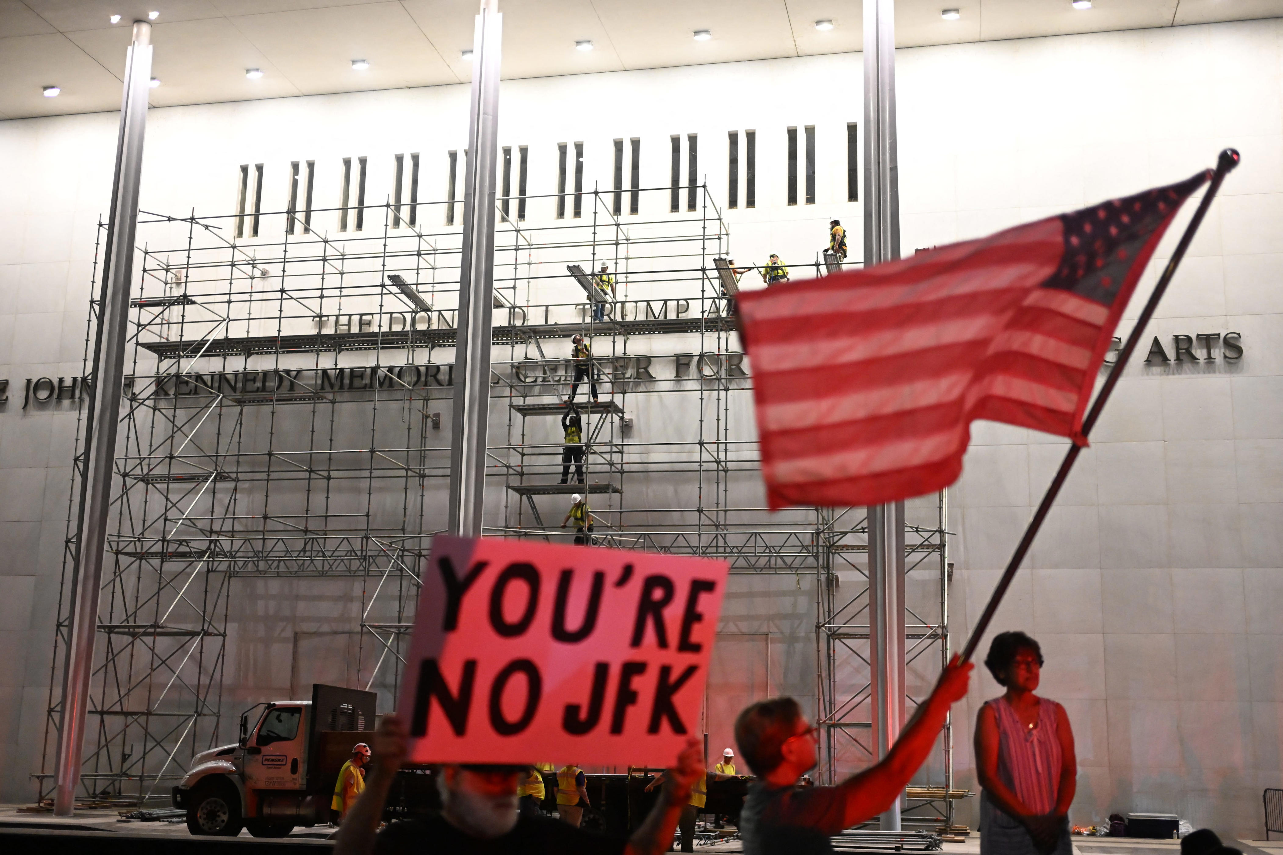 Workers remove Trump's name from Kennedy Center building