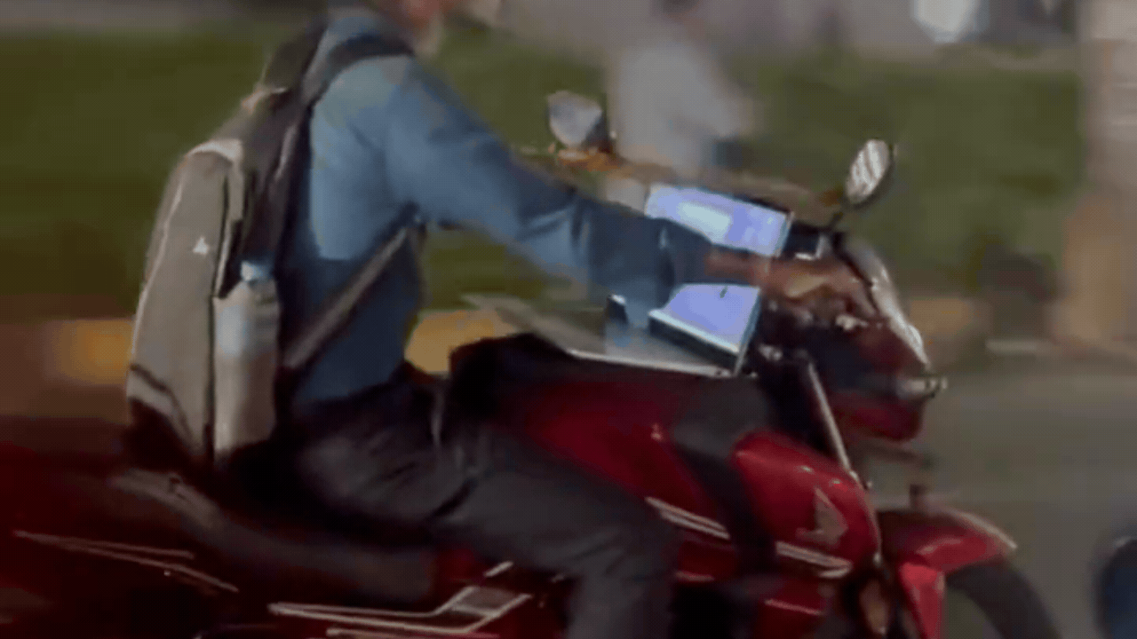 Hyderabad's 'work from bike' moment: Man uses laptop while riding bike ...
