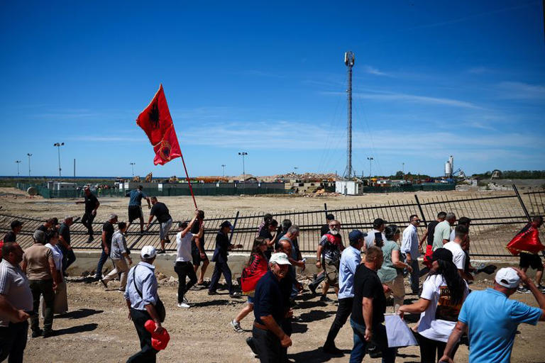 Protesters tear down Albanian development site fences amid anger over ...