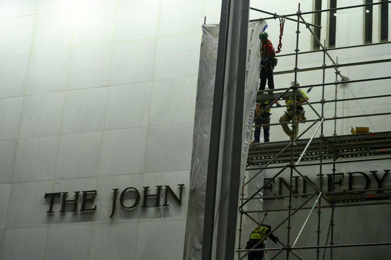 A tarp now covers where Trump's name used to hang at the Kennedy Center