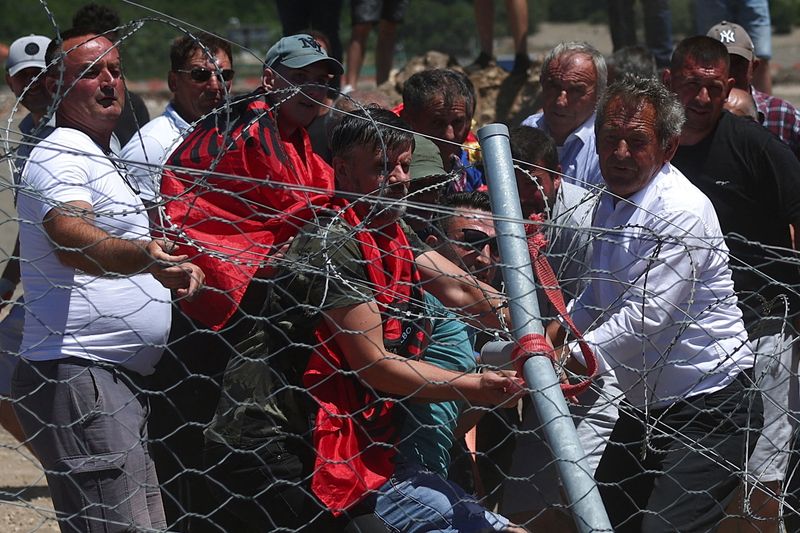 Protesters tear down Albanian development site fences amid anger over ...