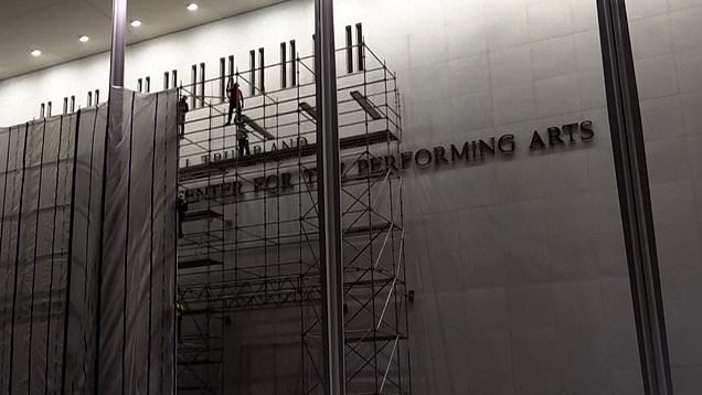 Workers remove Trump's name from Kennedy Center in Washington DC