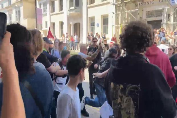 Watch as fight breaks out among anti-immigration and anti-fascist ...