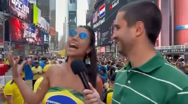 Brasileira viraliza na Copa com cartaz antibolsonarista