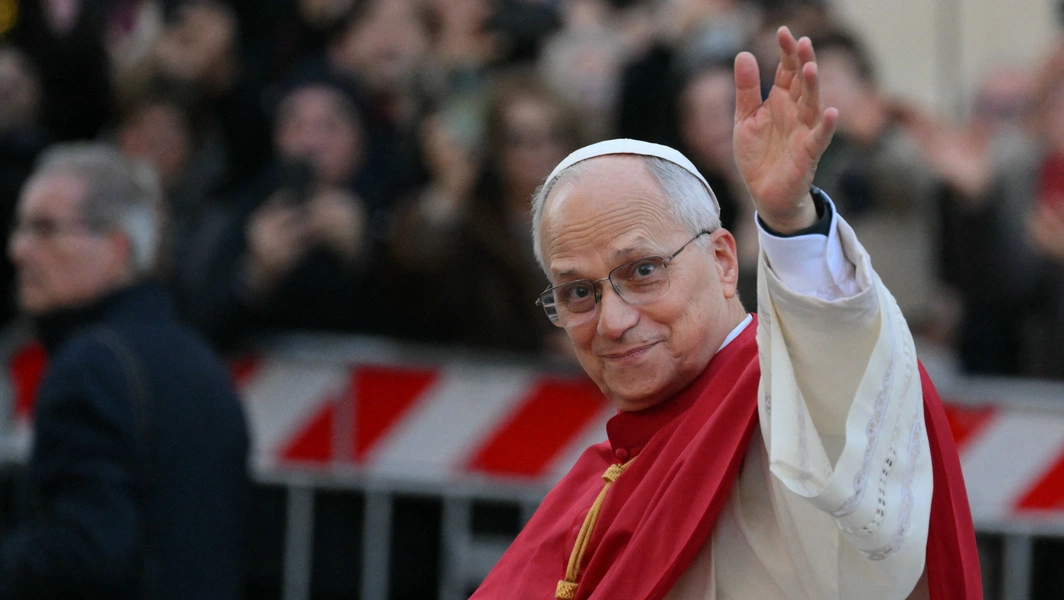 Photographer reunites with boy from viral papal visit photo