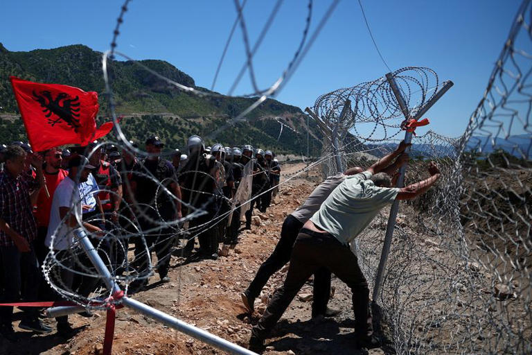 Protesters tear down Albanian development site fences amid anger over ...