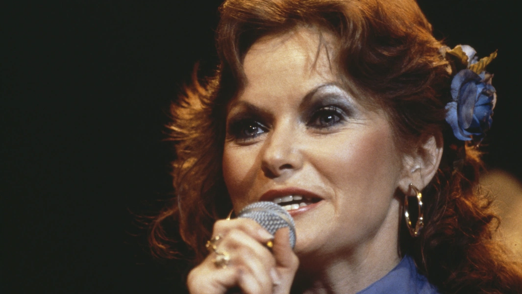 15 country songs with notable chart and award success