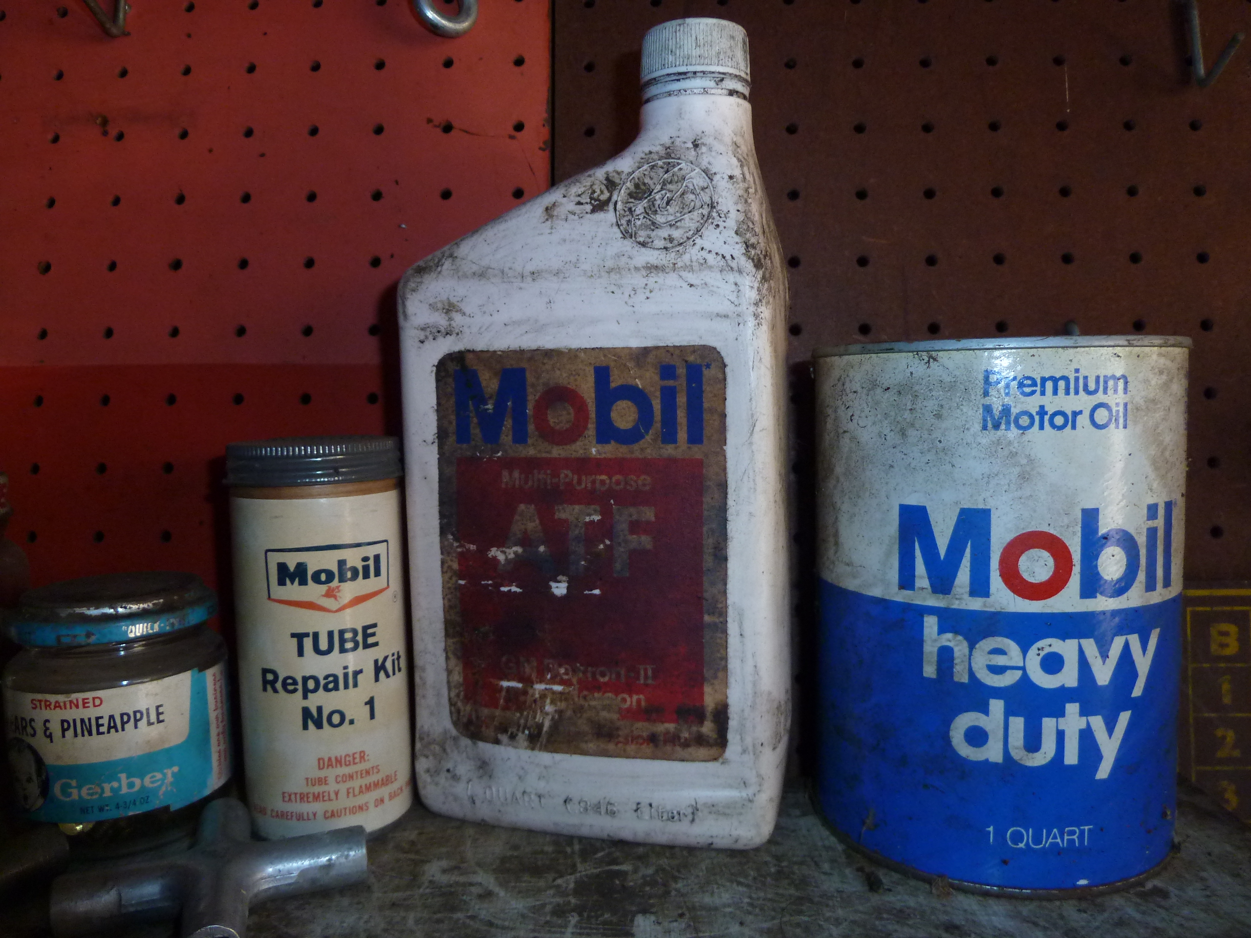 Old oil cans and automotive tins in the garage that petroliana ...