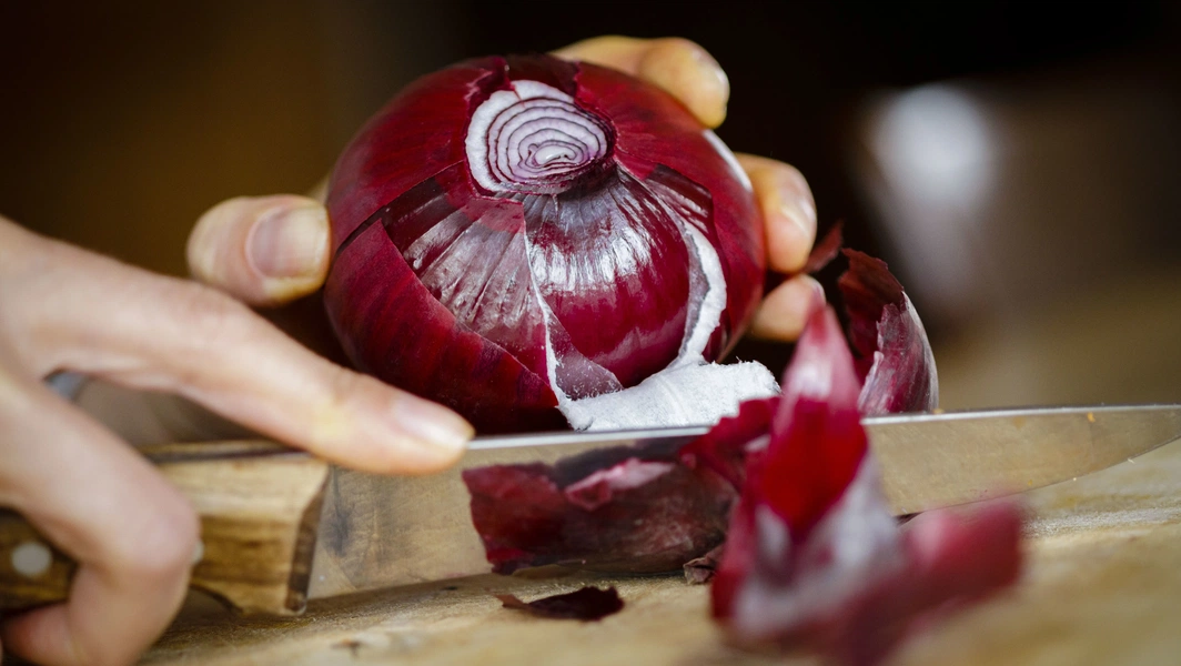 Techniques for cutting onions safely and efficiently