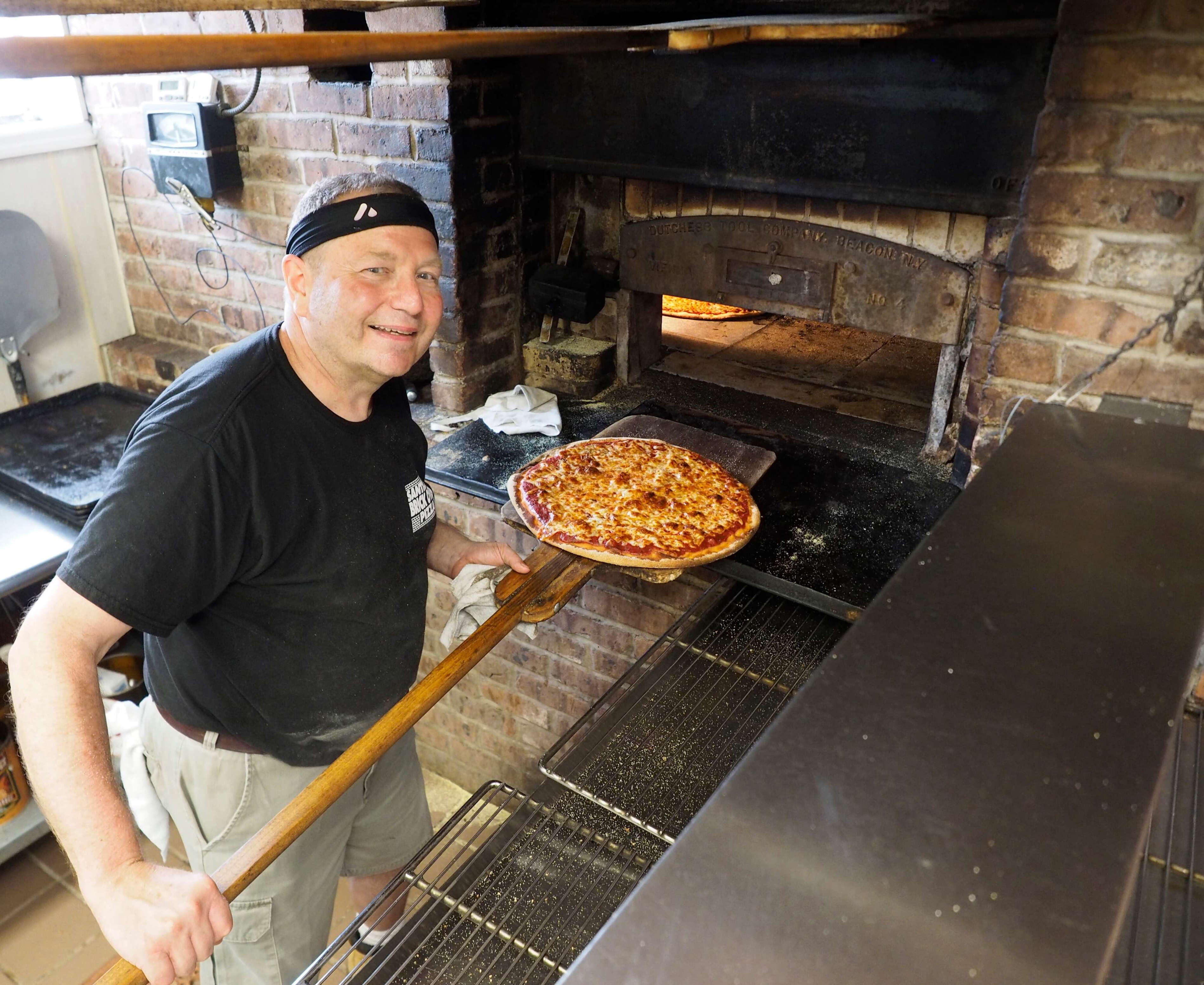 Iconic pizzeria, rebuilding from fire, may soon be sold. Here’s why