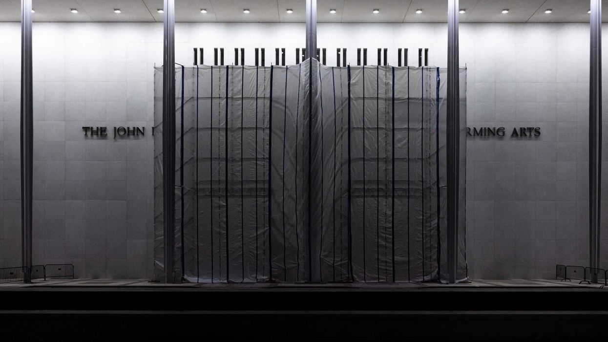 'Fragile' Trump mocked after 'giant curtain' used to hide name removal ...