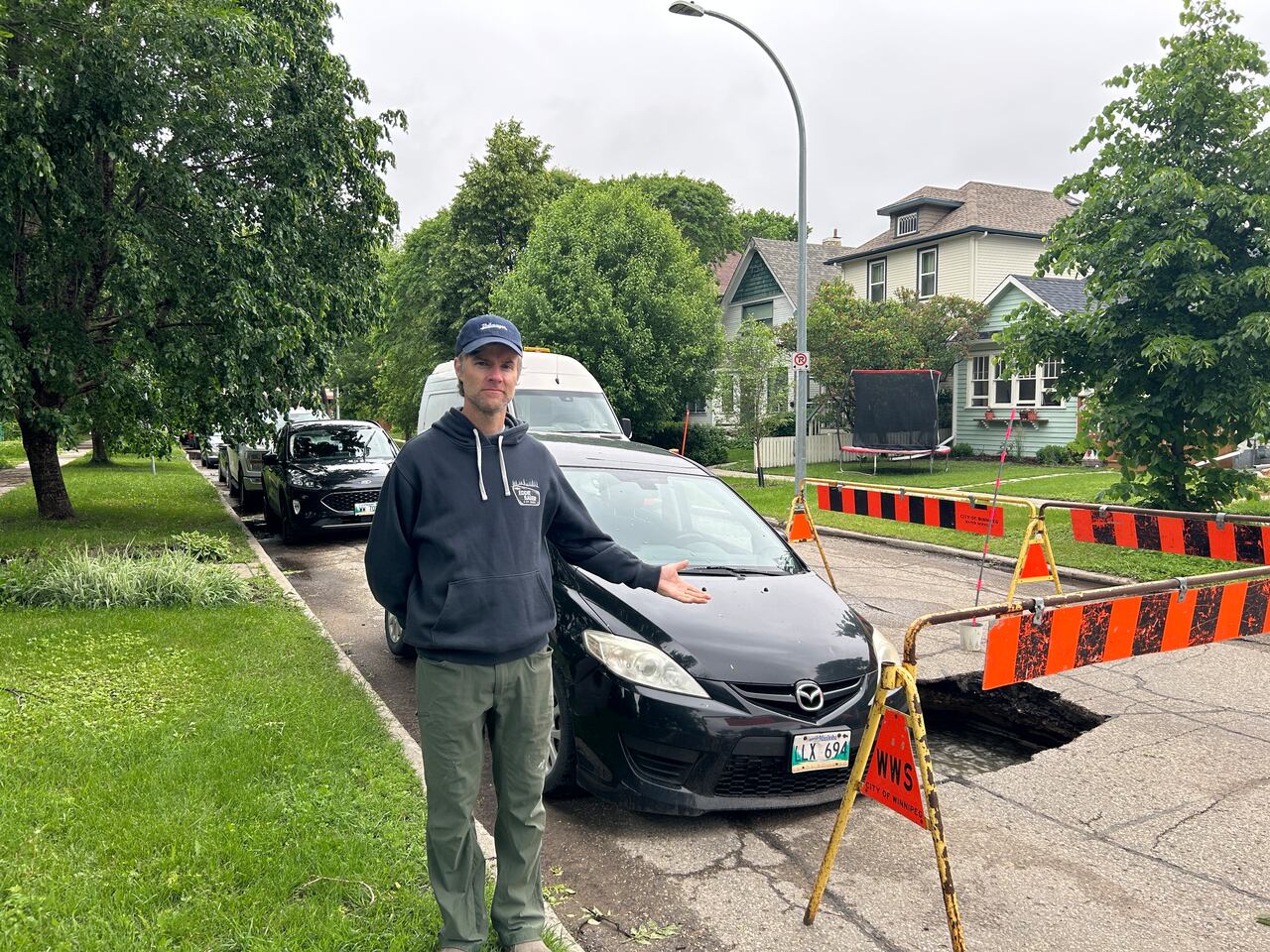 What a way to wake up! Winnipeg man finds his car slumped in sinkhole