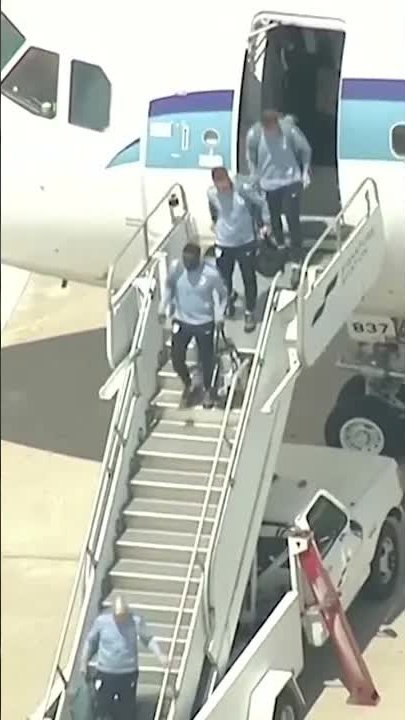England players step off plane in Kansas City