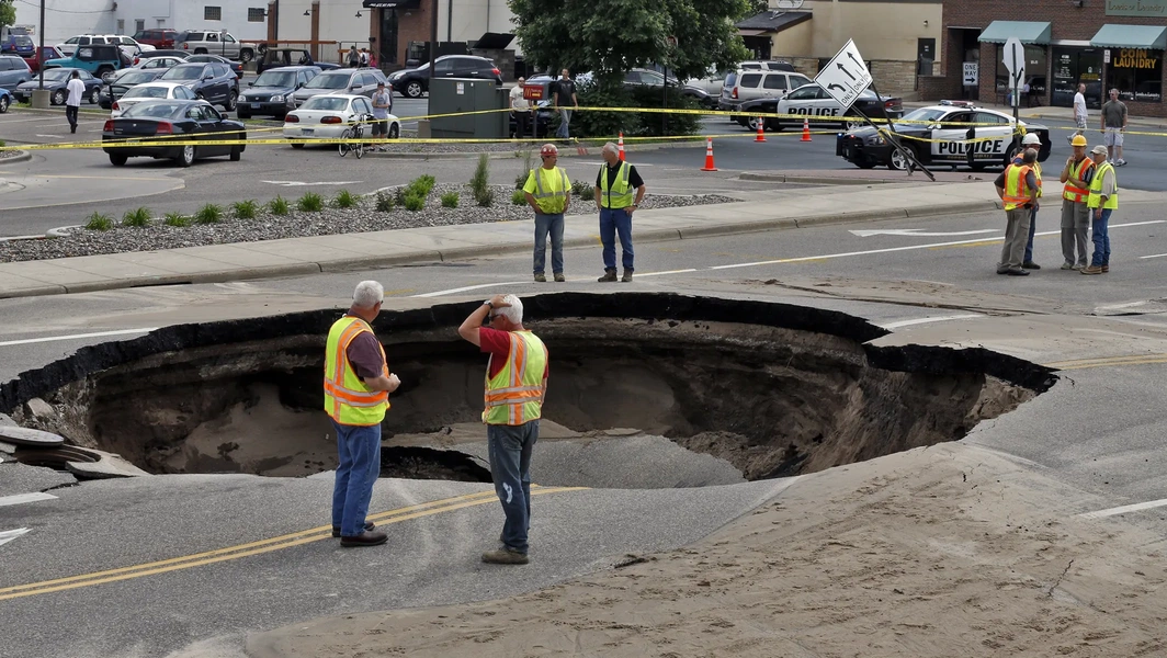 Multiple water main breaks trigger large sinkhole near I-70
